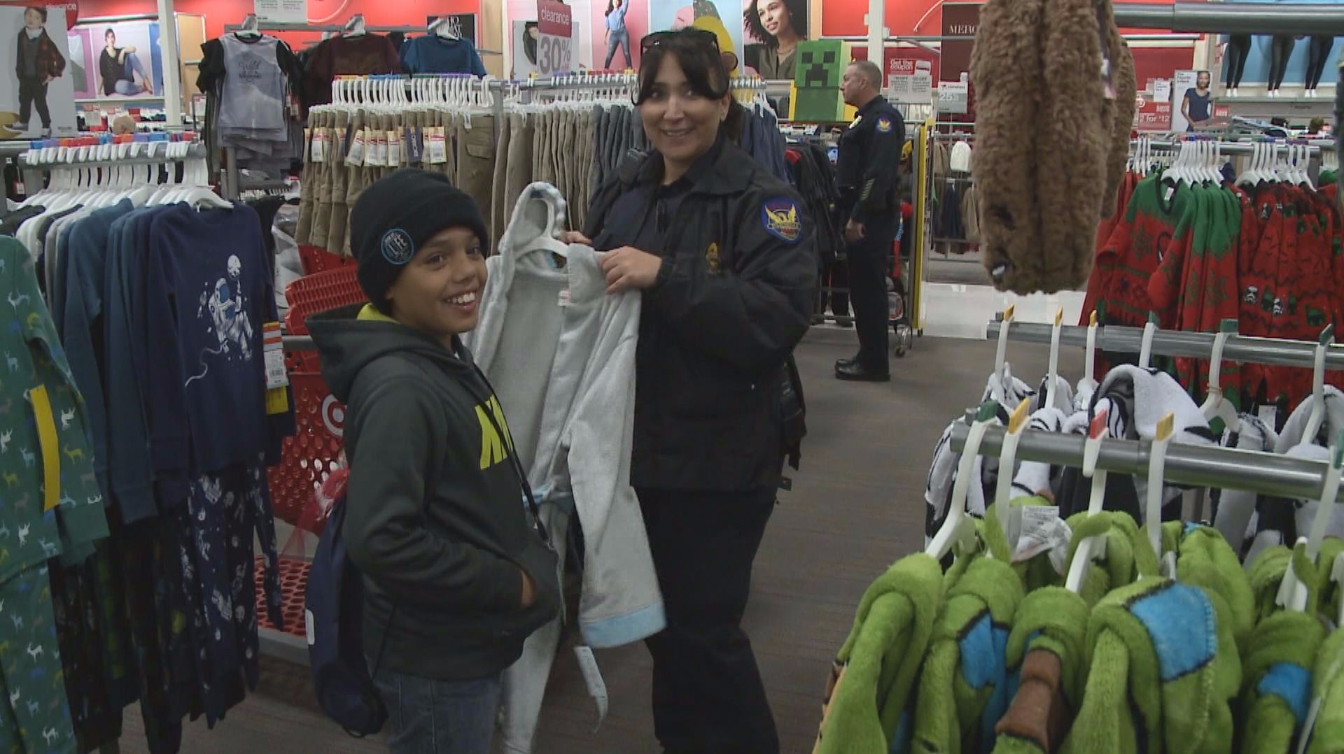 Phoenix police officers take kids holiday shopping | 12news.com